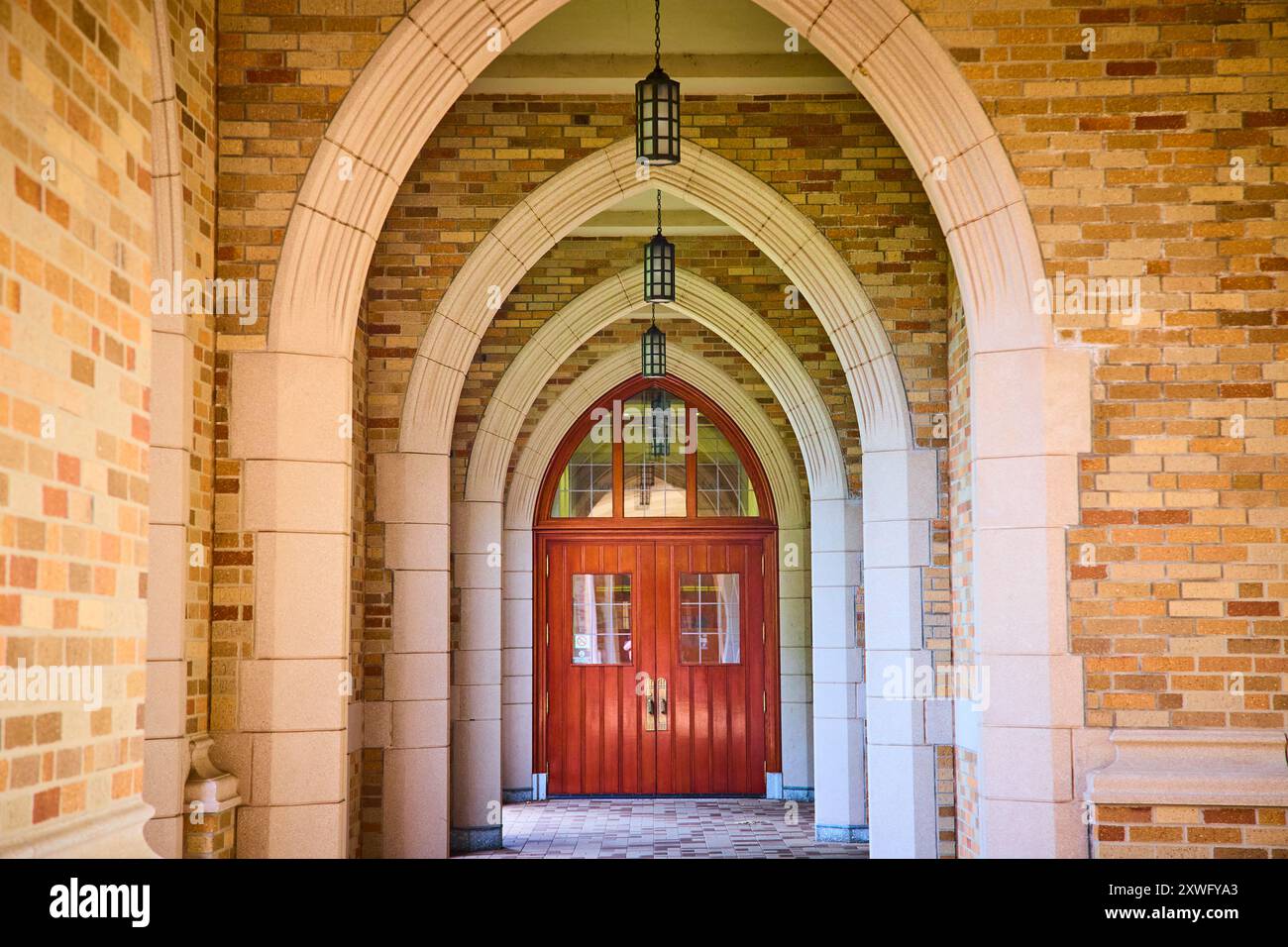 Brick Corridor with Arched Doorways Leading to Wooden Door Perspective ...