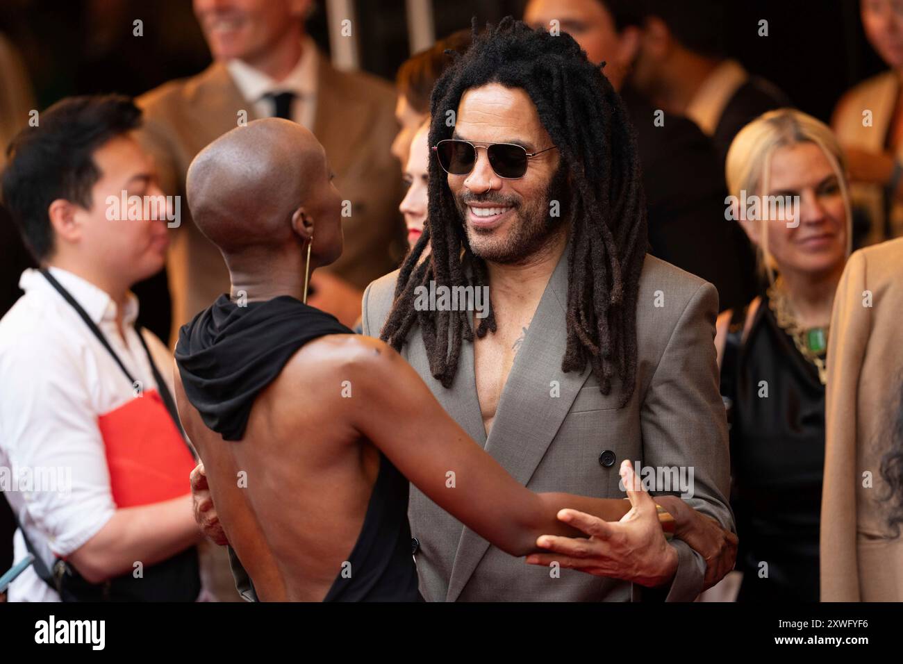 Tiffany Persons, left, and Lenny Kravitz pose for photographers upon ...