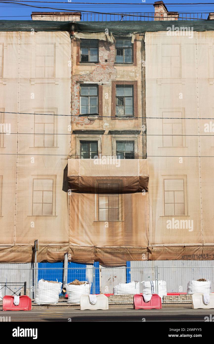 Repair construction work of the facade of an old building Stock Photo ...