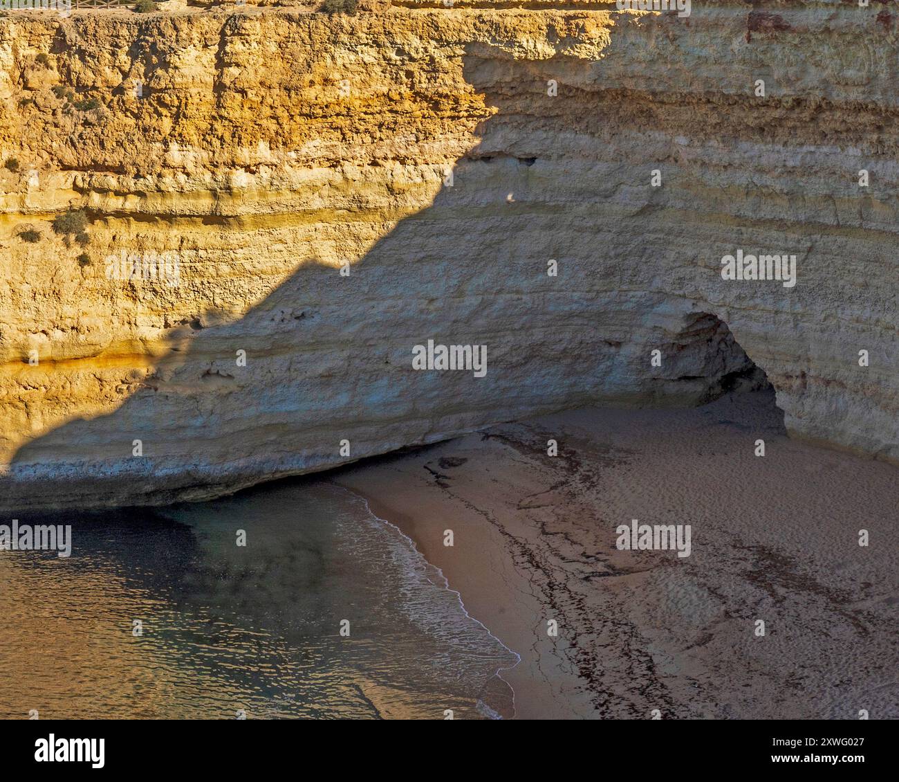 Carvalho Beach , Layers of sediment in rocks seen on the coastline ...