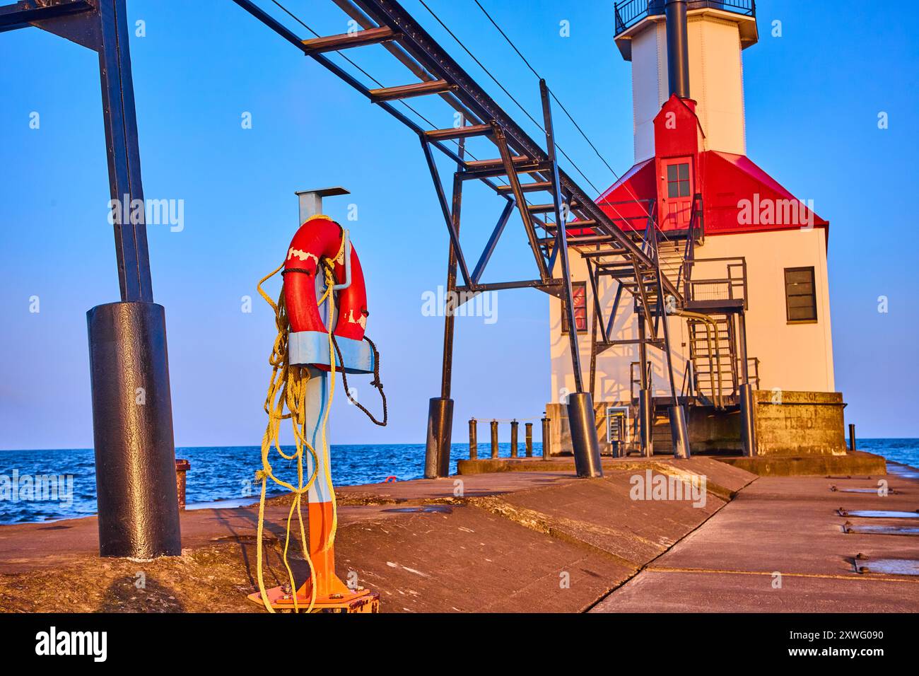 Lighthouse on Pier at Golden Hour with Life Preserver Eye-Level View ...