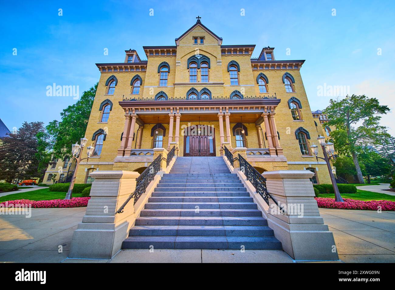 Historic University Building with Grand Staircase and Columns Low-Angle ...