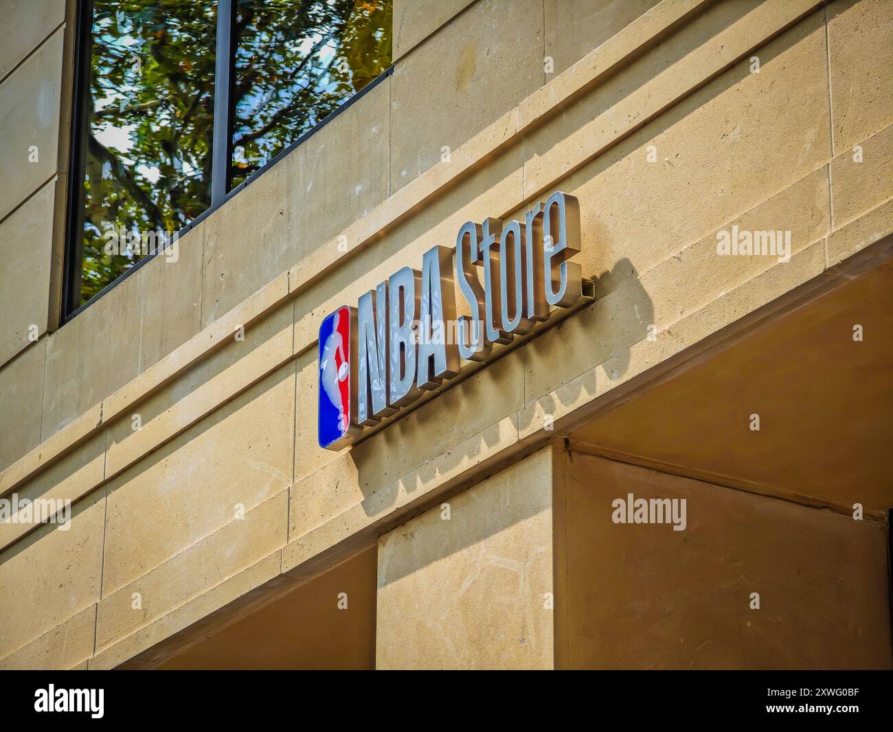 08 19 2024 - Paris, France. NBA store sign with league logo on an old ...