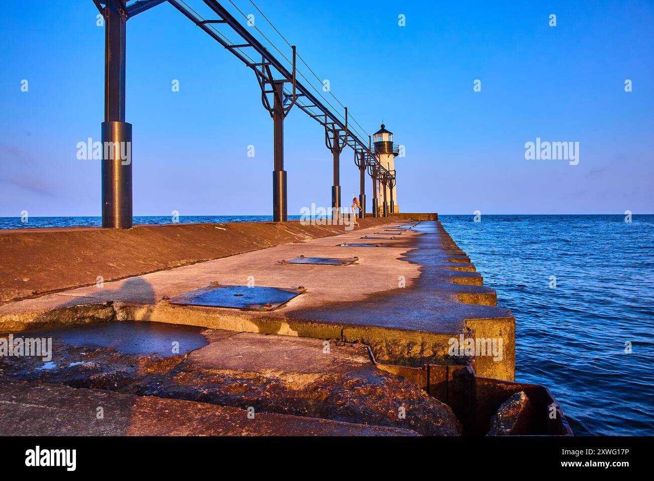 Lighthouse Pier at Golden Hour with Person Walking Perspective Stock ...