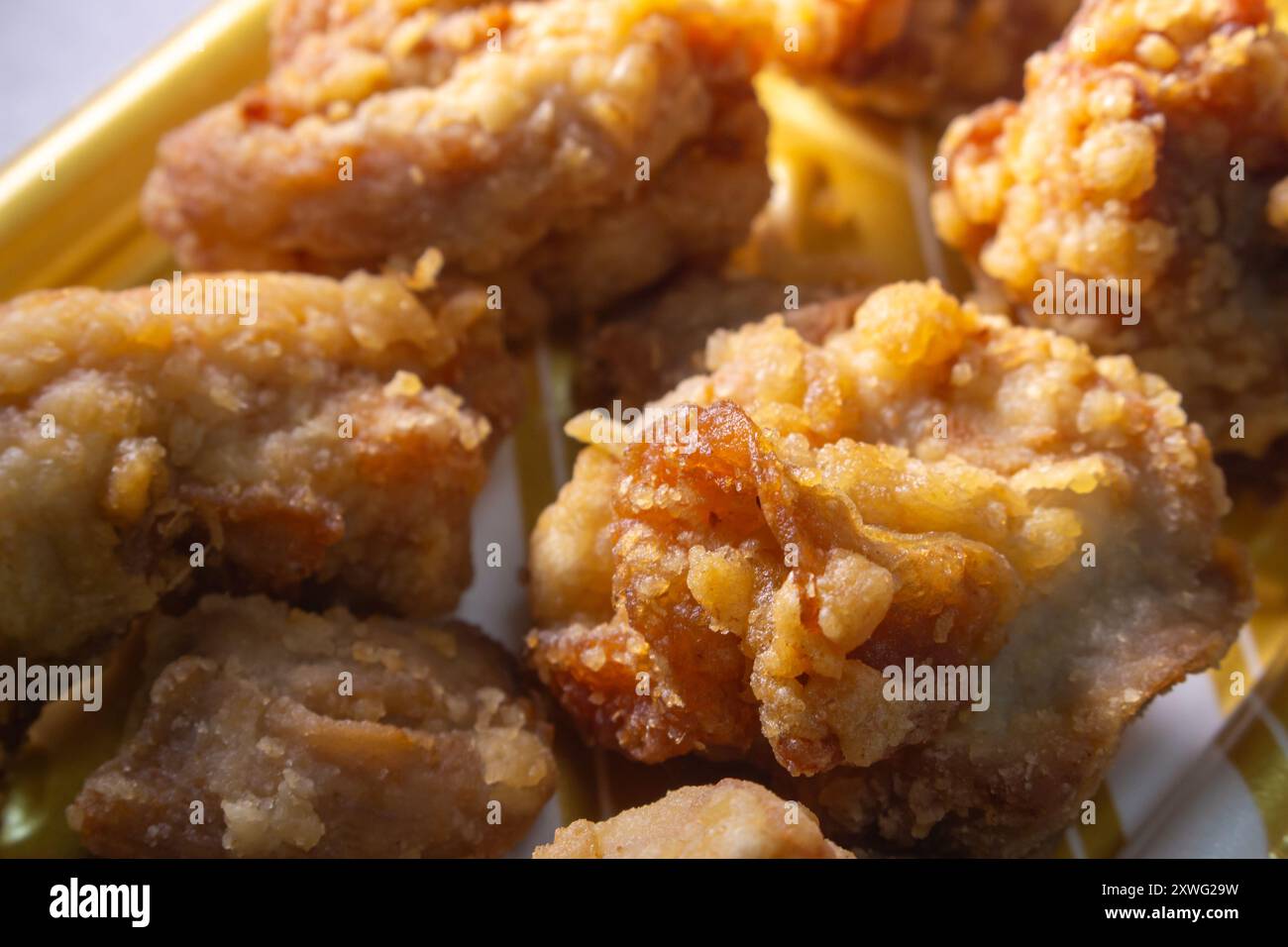 Close-up of golden, crispy fried chicken pieces, showing detailed ...
