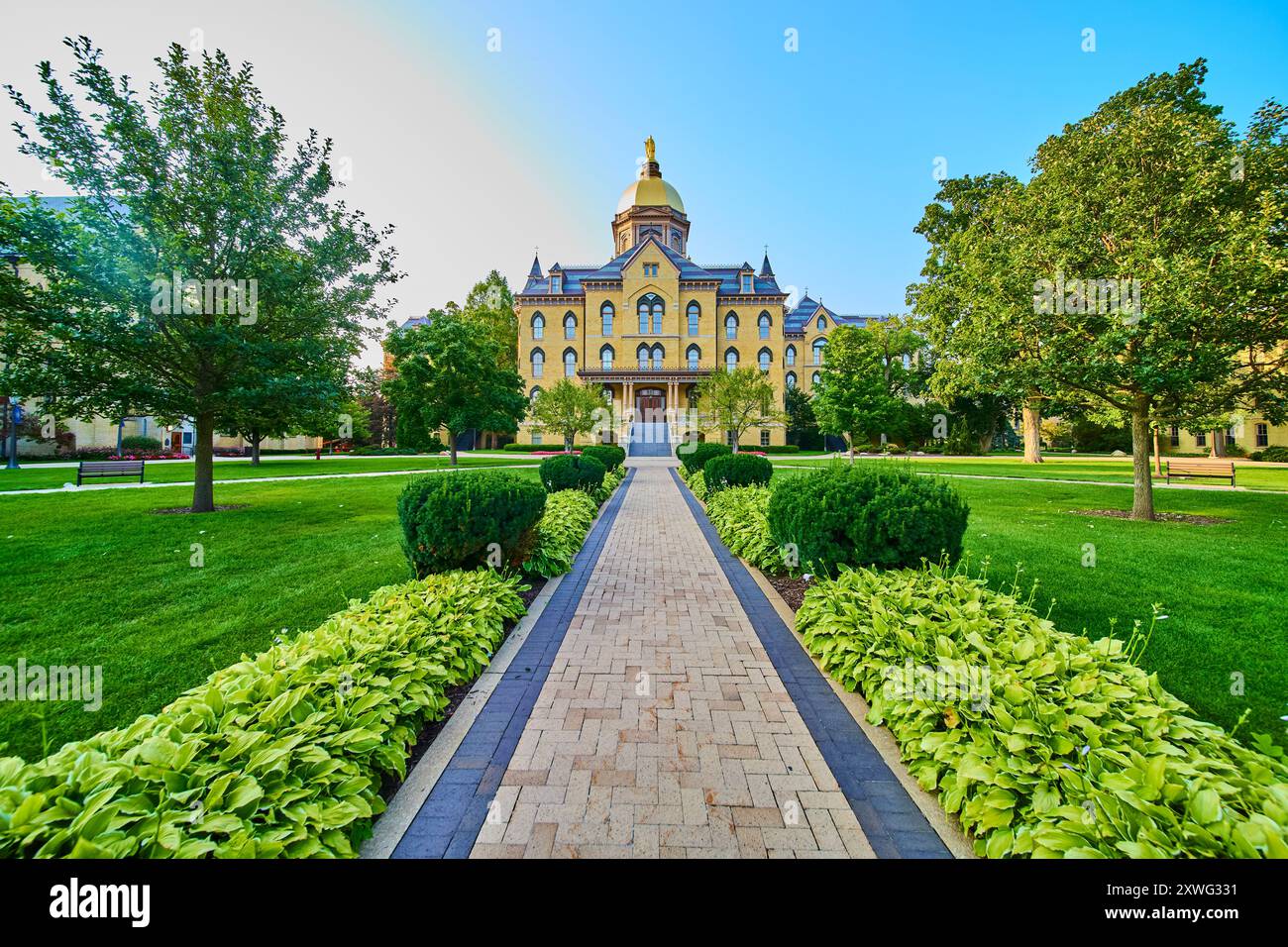 Historic Notre Dame Golden Dome Building on Lush Campus Pathway ...