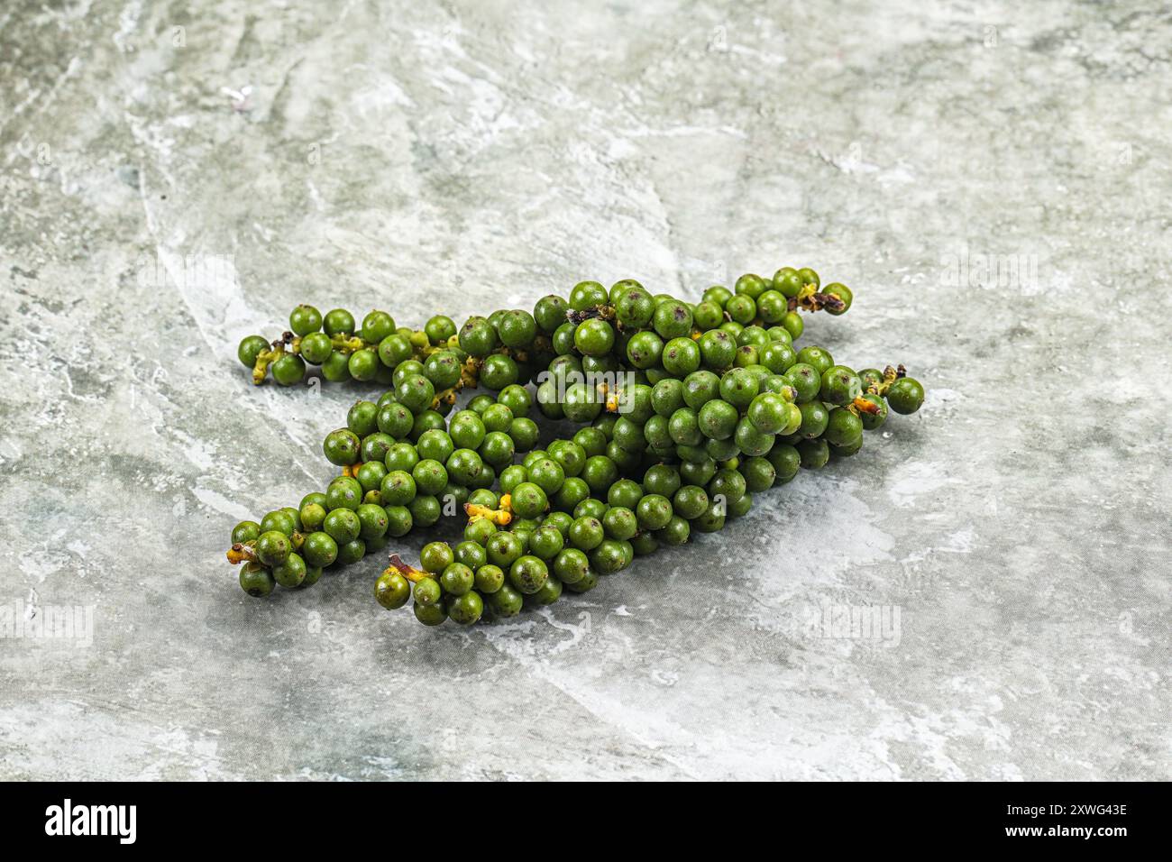 Green pepper corn on the branch heap Stock Photo - Alamy