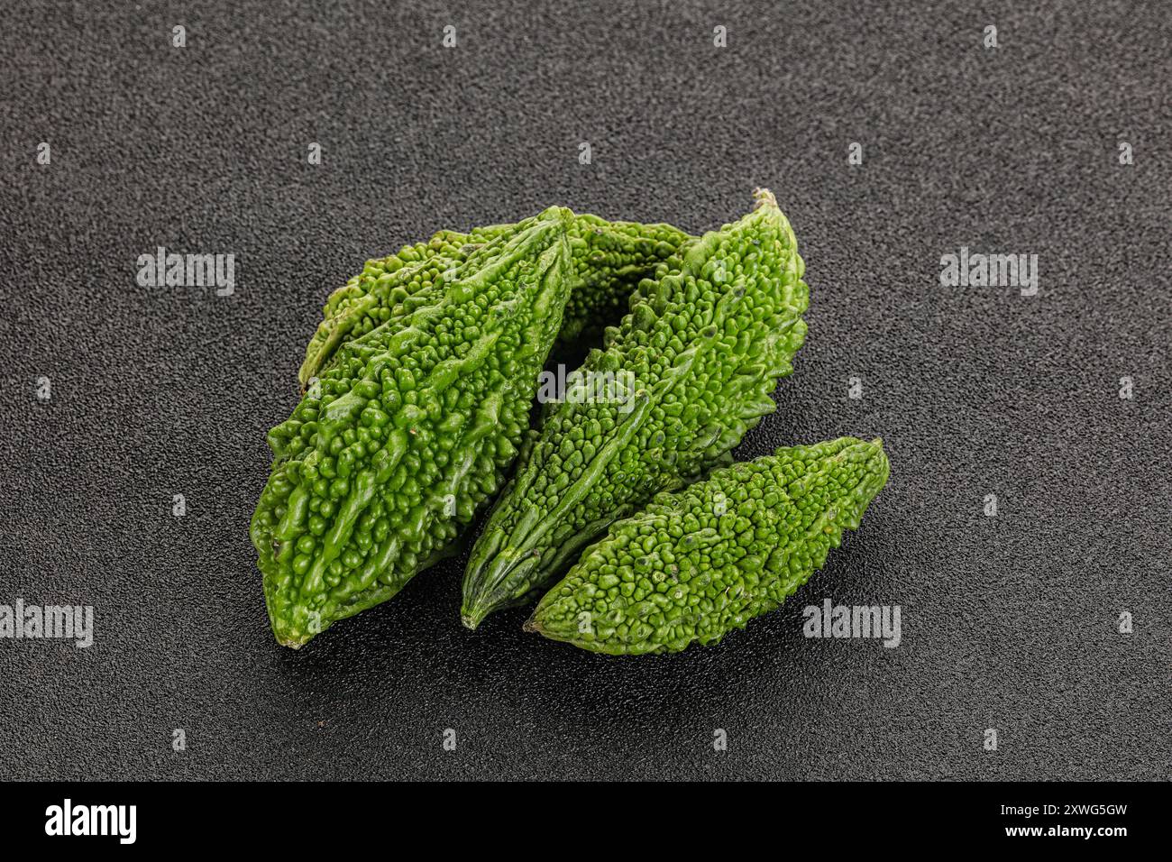 Green raw bitter lemon vegetables heap Stock Photo - Alamy