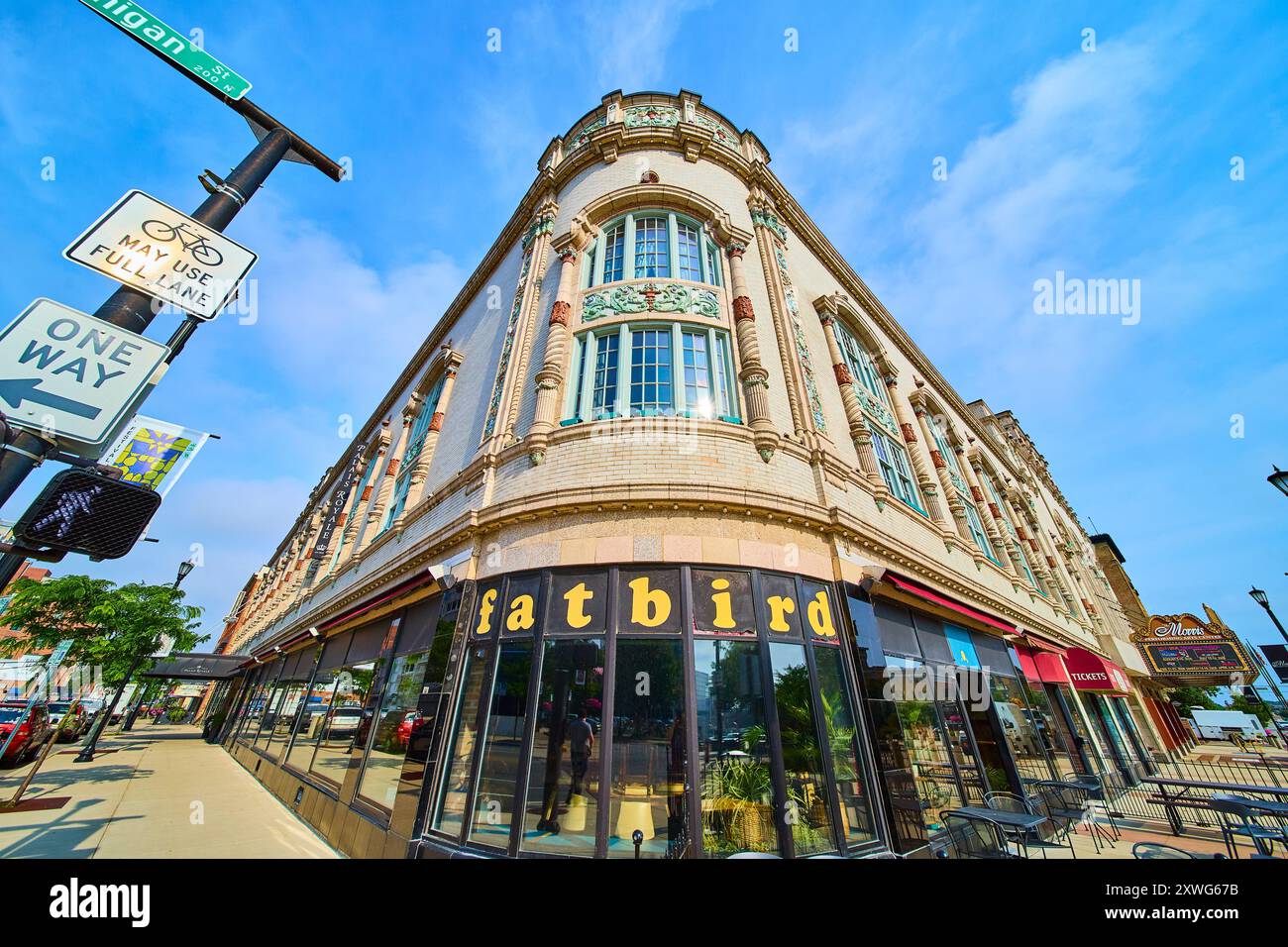 Ornate Downtown Building with Cafe at Busy Street Corner Eye-Level View ...