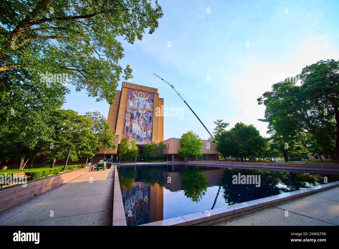Campus Mural Reflection with Crane and Tranquil Pool Eye-Level View ...