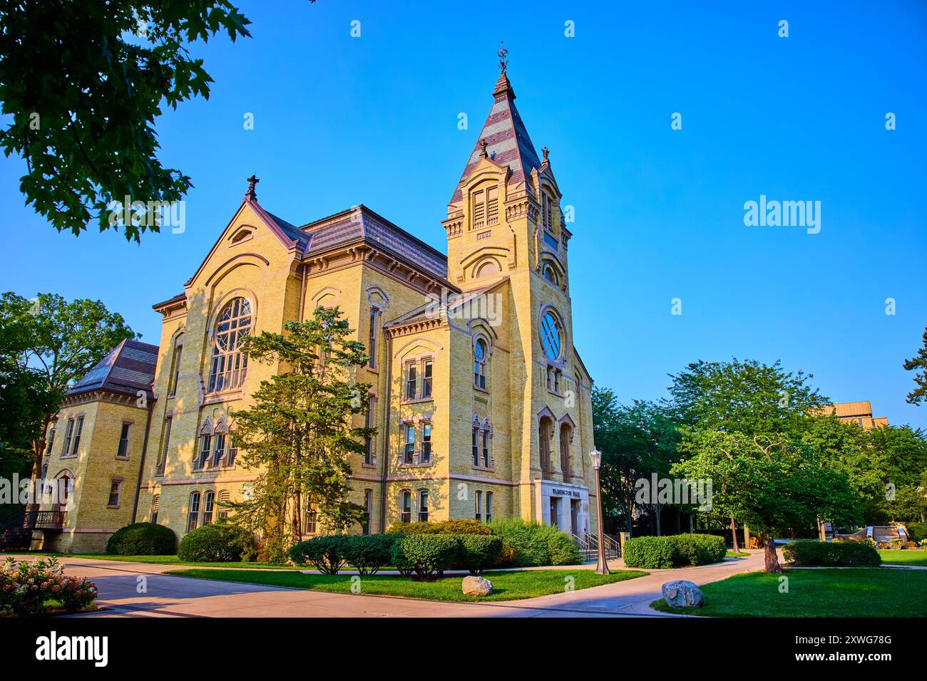Majestic Historic University Hall with Tower at Golden Hour Eye Level ...