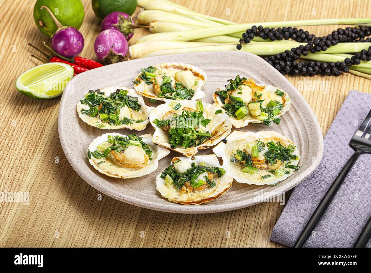 Grilled scallops with green onion and sauce Stock Photo - Alamy