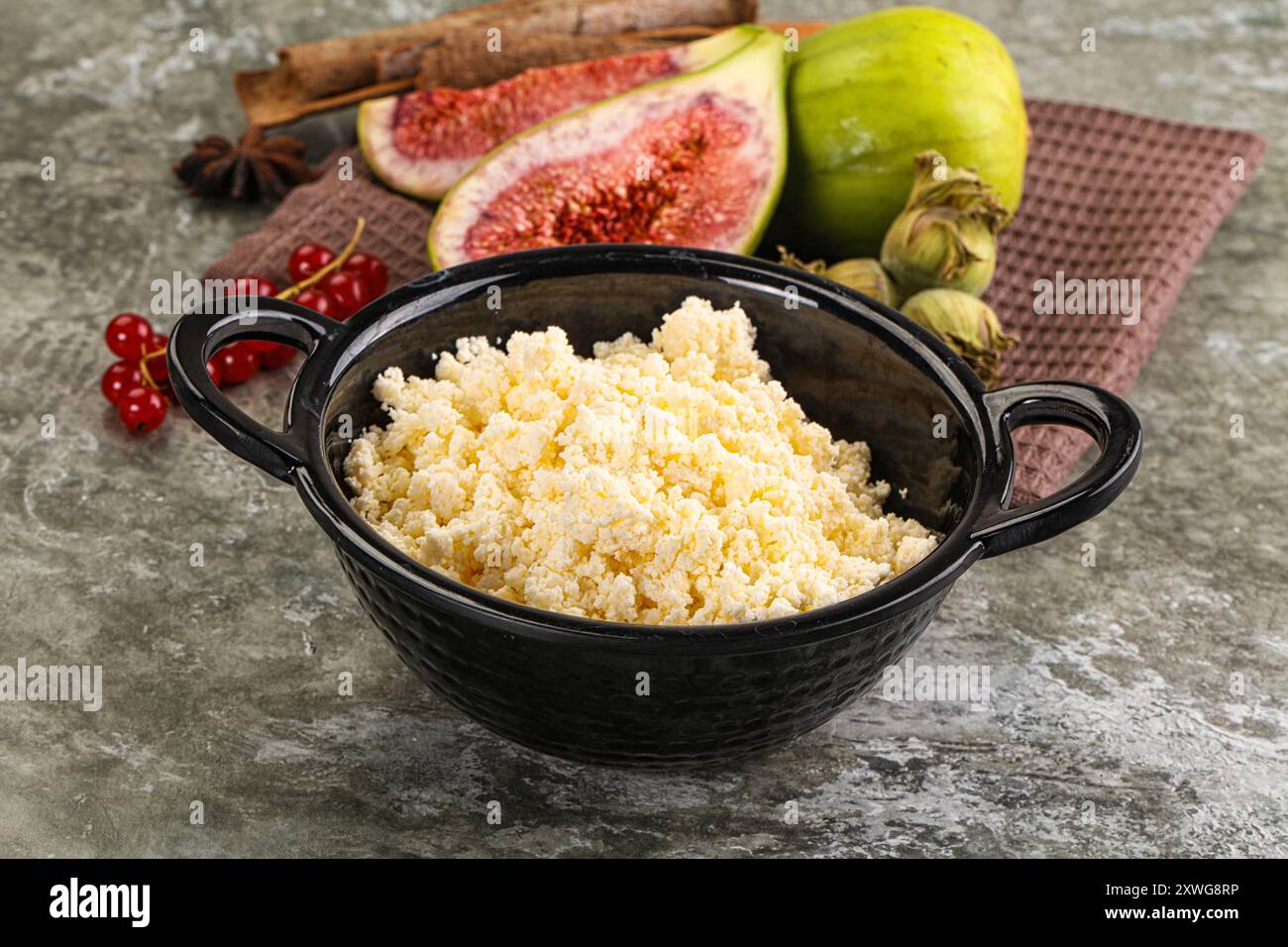 Delicous sheep cottage cheese curd served fig Stock Photo - Alamy