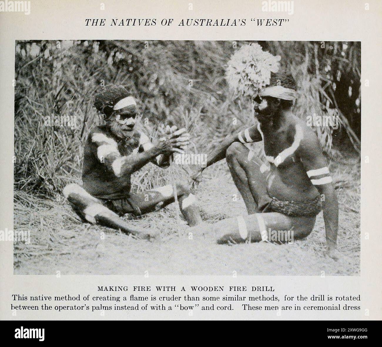 Two aboriginal man from western Australia making fire with wooden fire ...