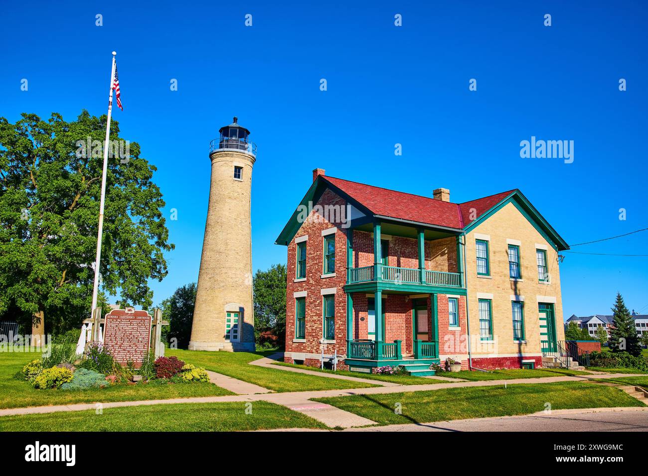 Historic Kenosha Lighthouse and Brick House with American Flag Daytime ...