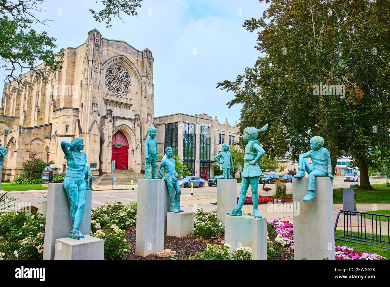 Bronze Statues and Gothic Cathedral in Bronson Park Eye-Level View ...