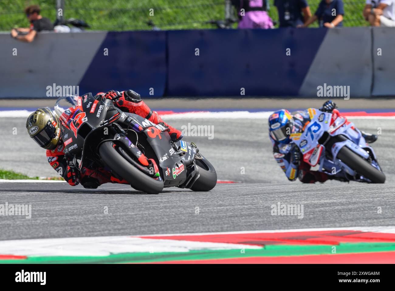 Maverick VINALES (SPA) - Aprilia Racing exits from turn 1 followed by ...