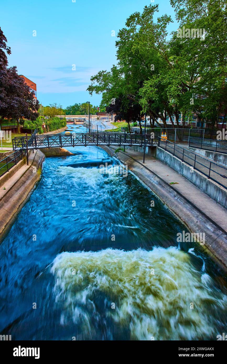 South Bend Riverfront Canal with Pedestrian Bridge and Rapid Water ...