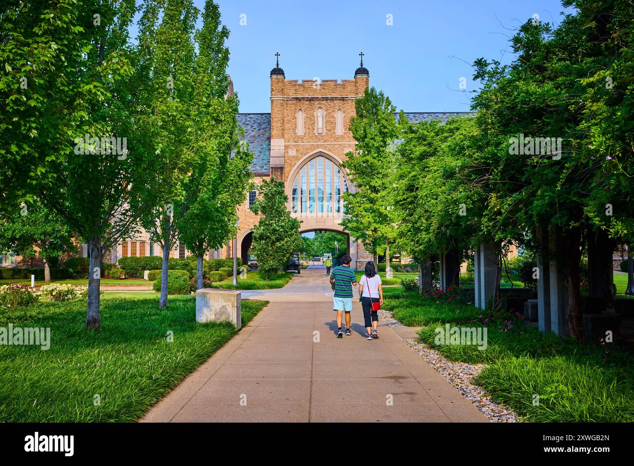 Gothic Campus Building and Pathway with People Walking Eye-Level View ...