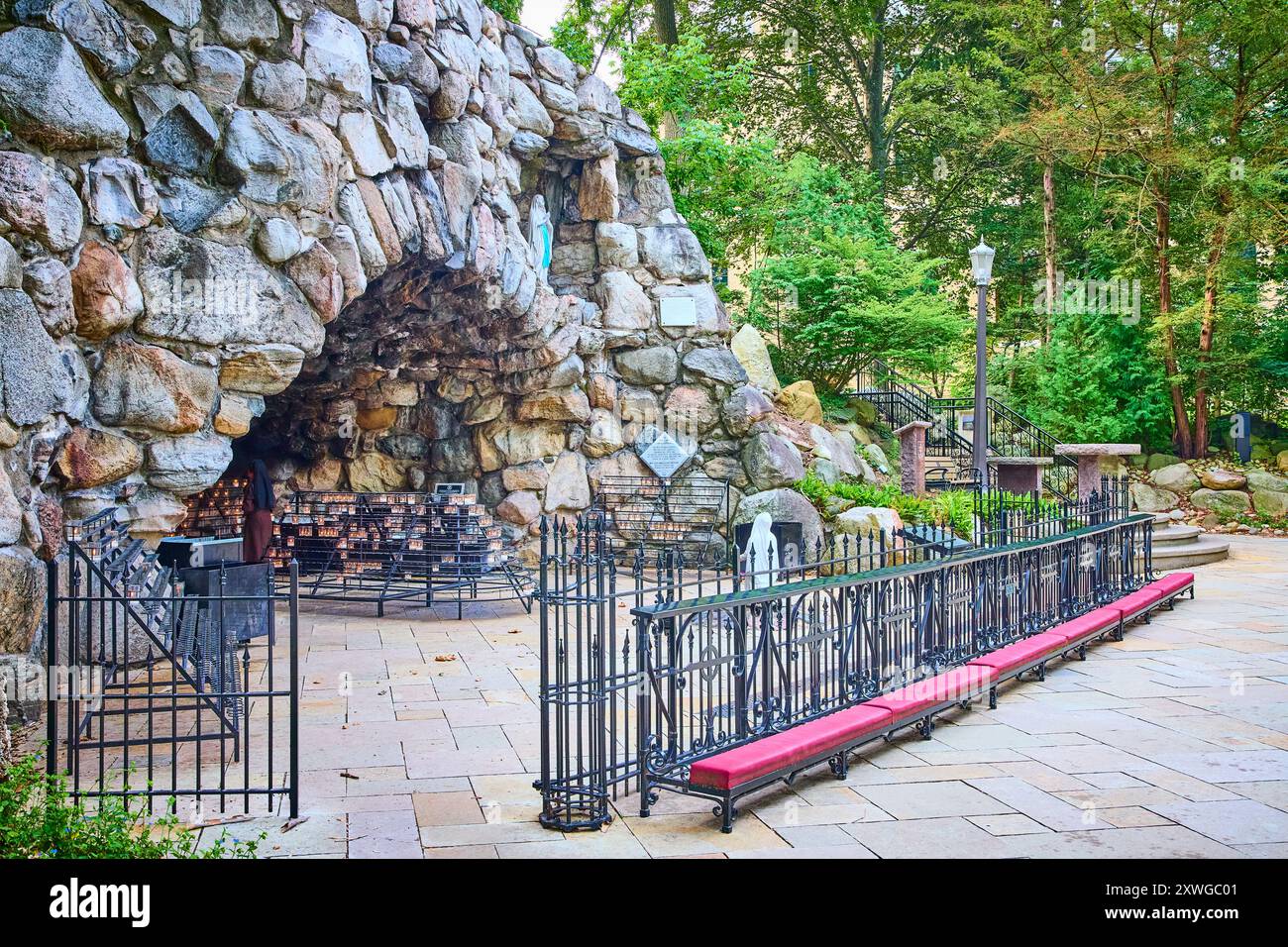 Stone Grotto with Prayer Candles and Statue Eye Level View Stock Photo ...