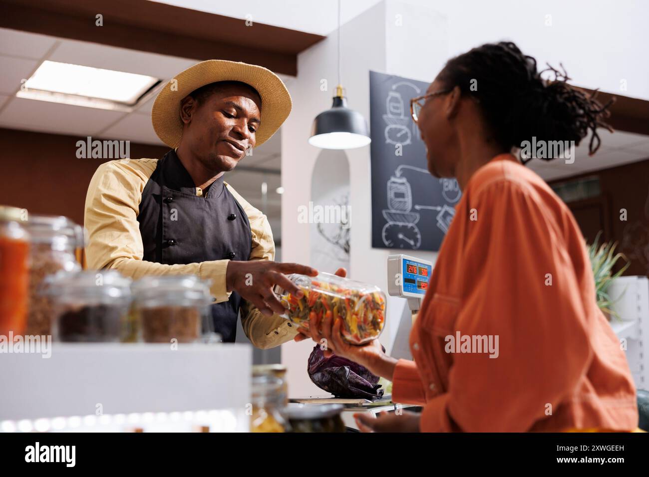 African American woman discusses eco friendly shopping with the ...