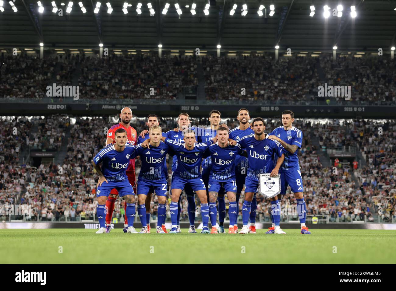 Turin, Italy, 19th August 2024. The Como 1907 starting eleven line up ...