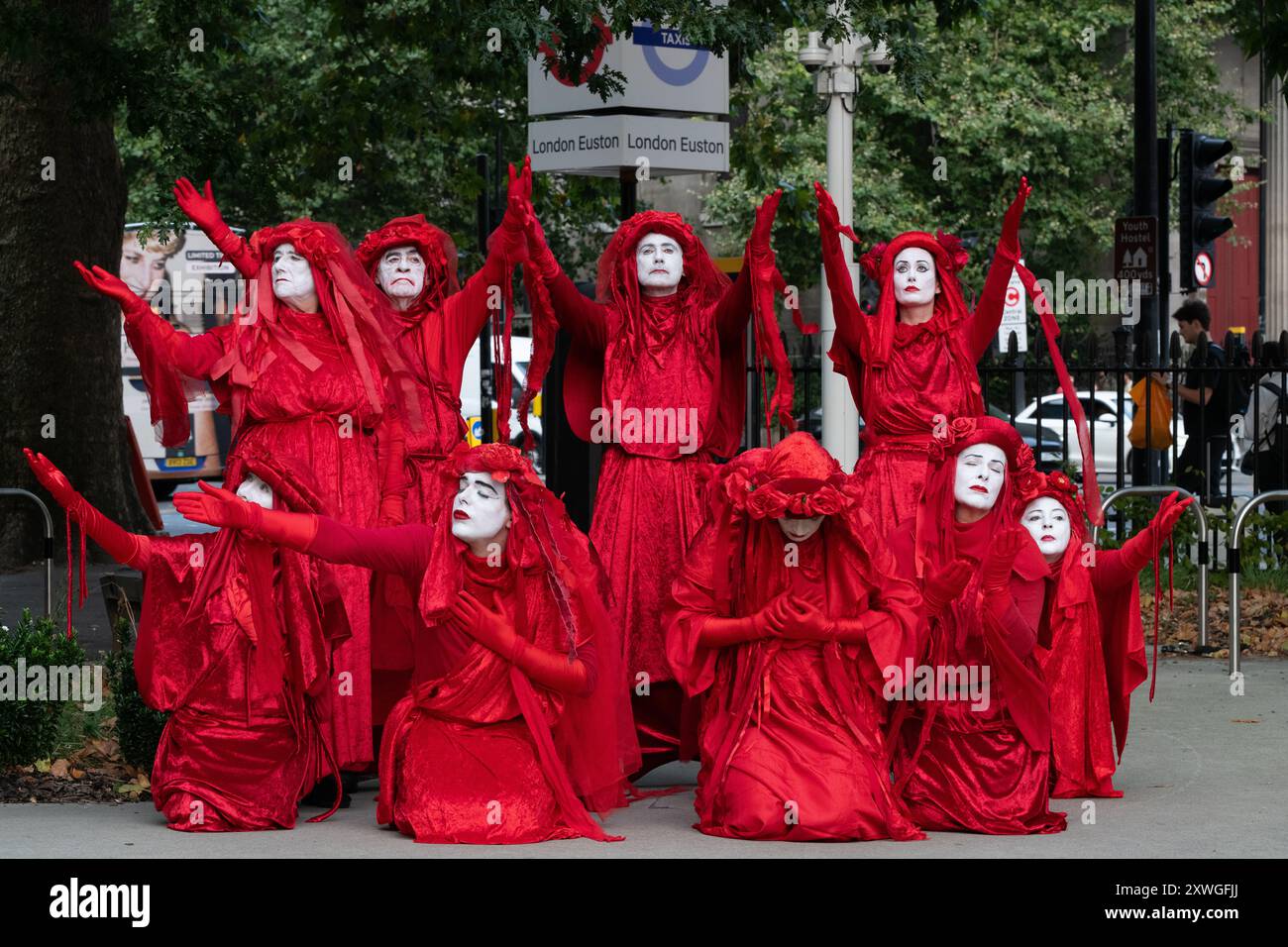 London, UK. 19 August, 2024. Extinction Rebellion's Red Rebel activist ...