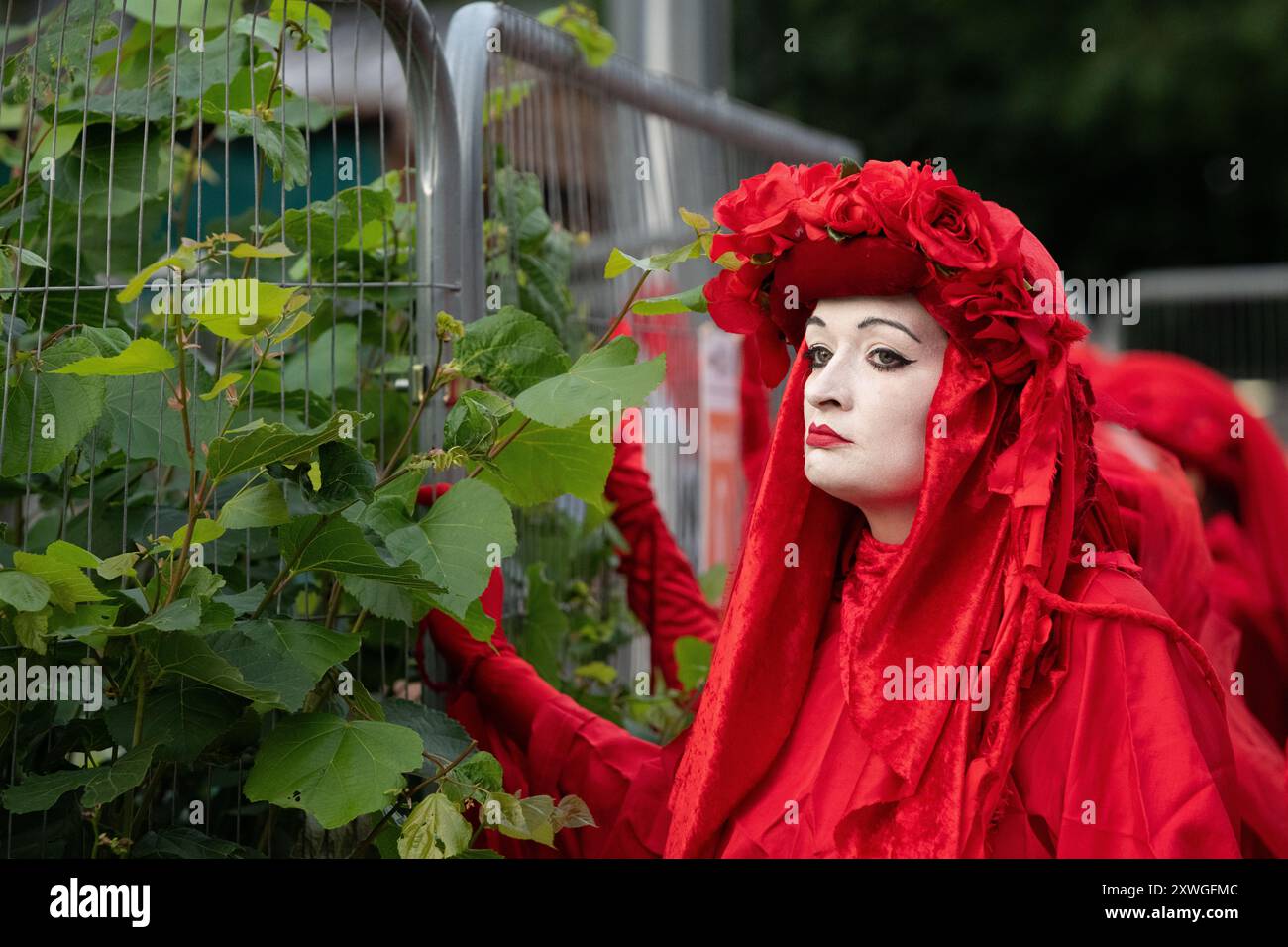 London, UK. 19 August, 2024. Extinction Rebellion's Red Rebel activist ...