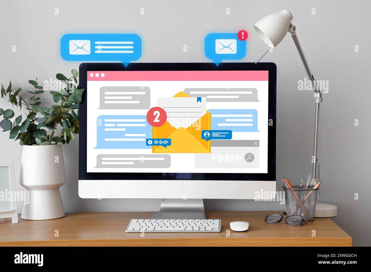 Received email messages on screen of computer monitor at workplace ...