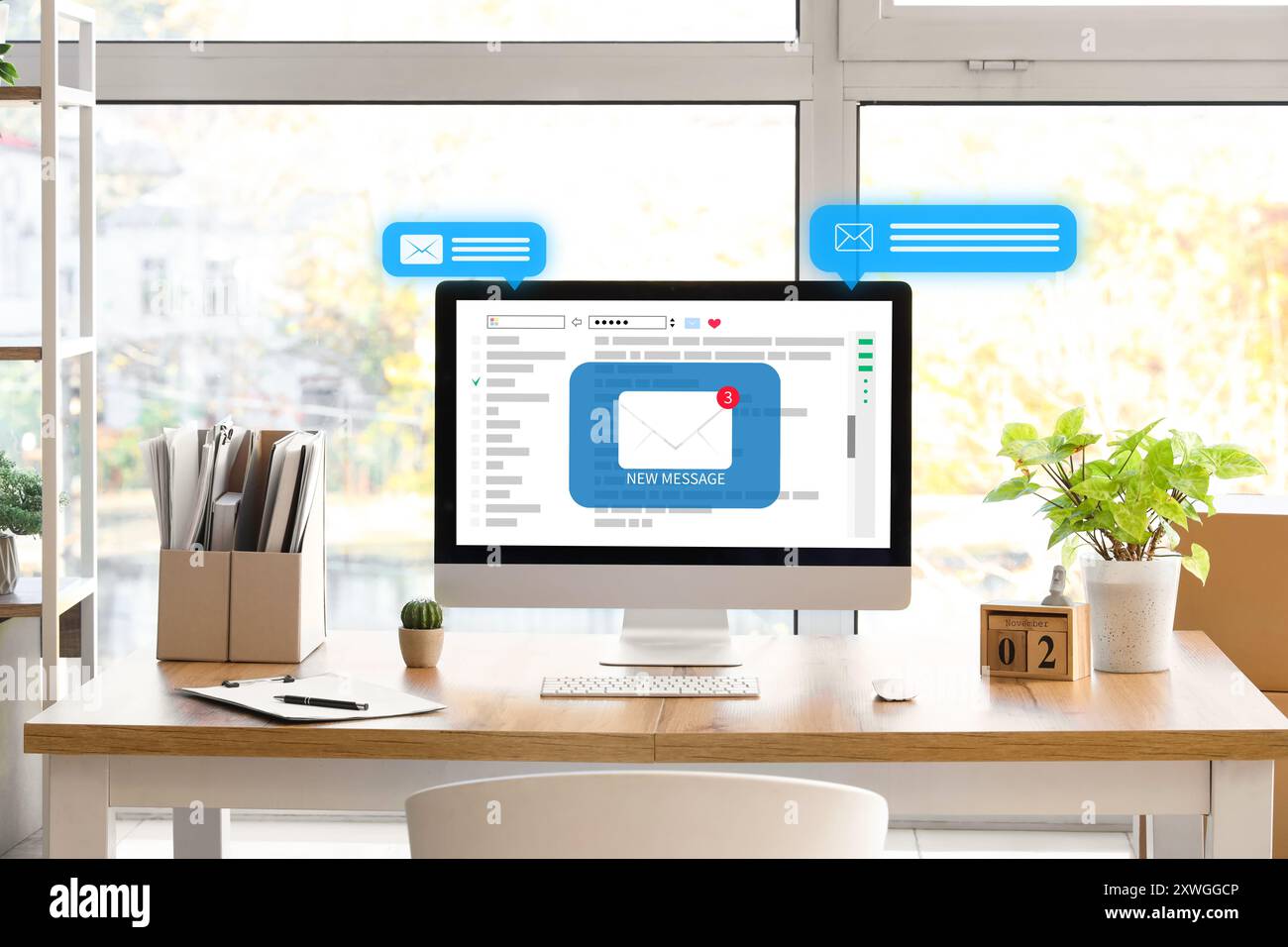 Received email messages on screen of computer monitor at workplace ...