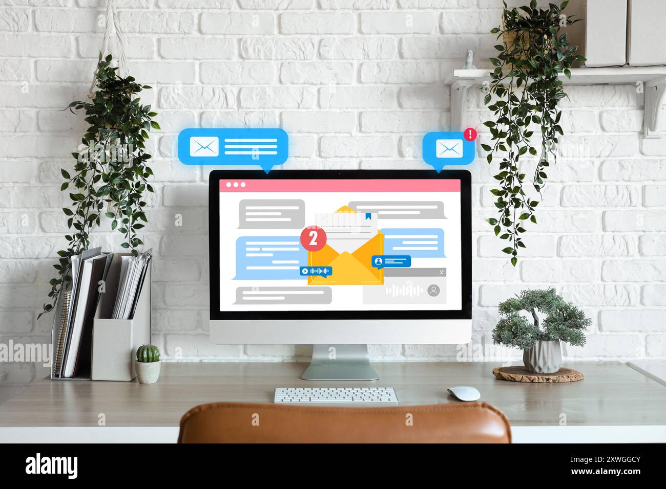 Received email messages on screen of computer monitor at workplace ...