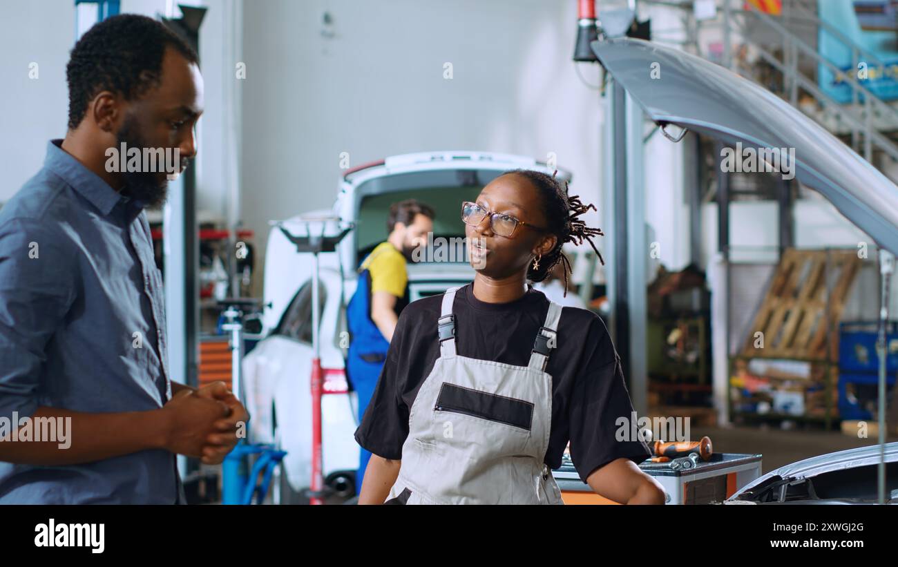 Mechanic man examining maintenance customer hi-res stock photography ...
