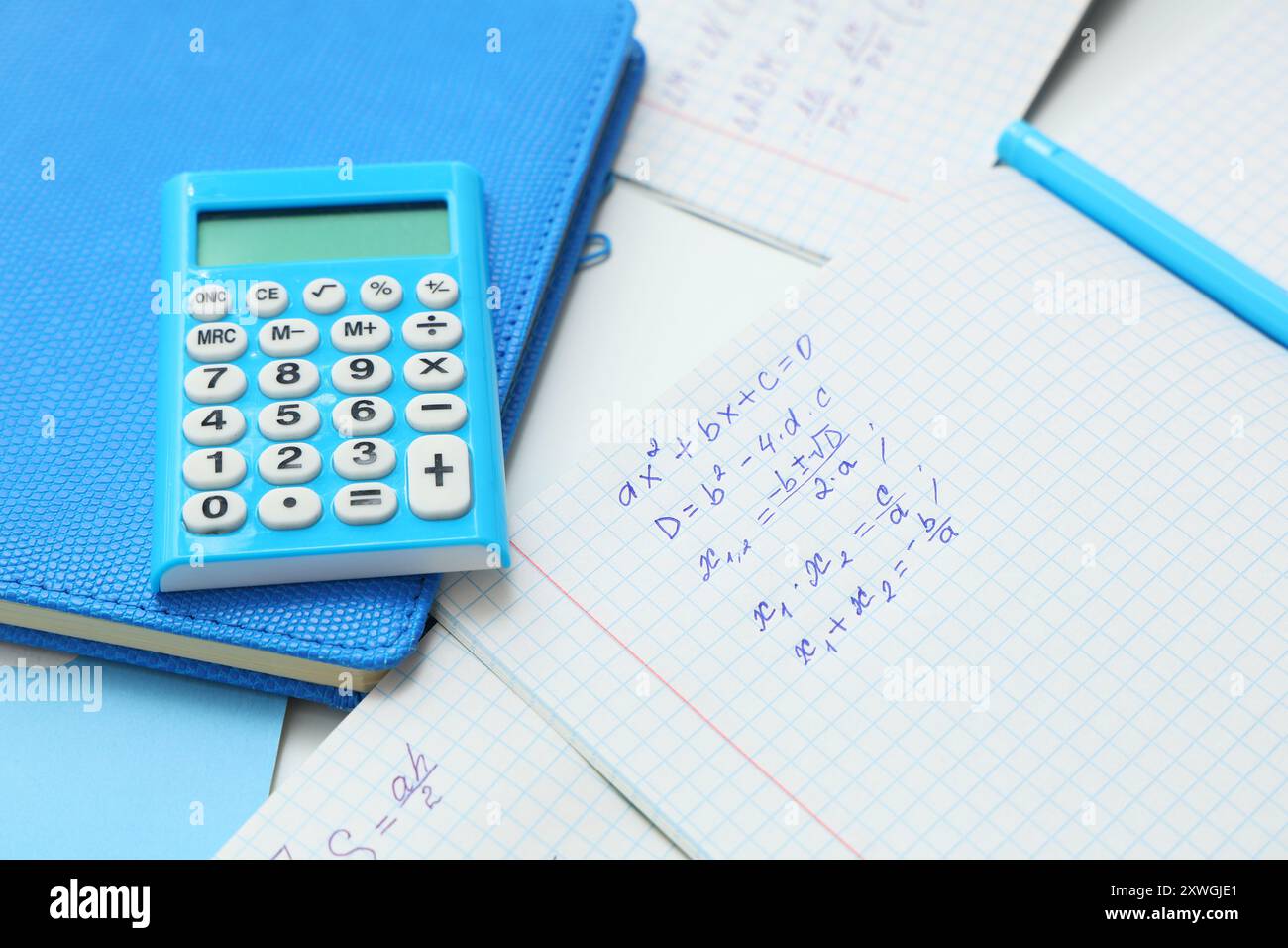 Copybooks with math formulas, notebook and calculator, closeup Stock ...