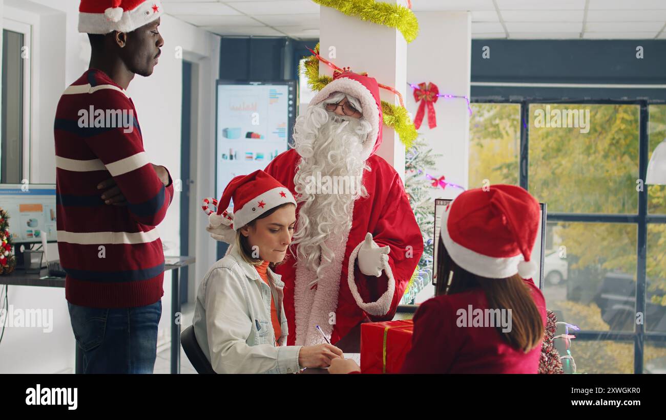 Employees wearing santa claus hat hi-res stock photography and images ...