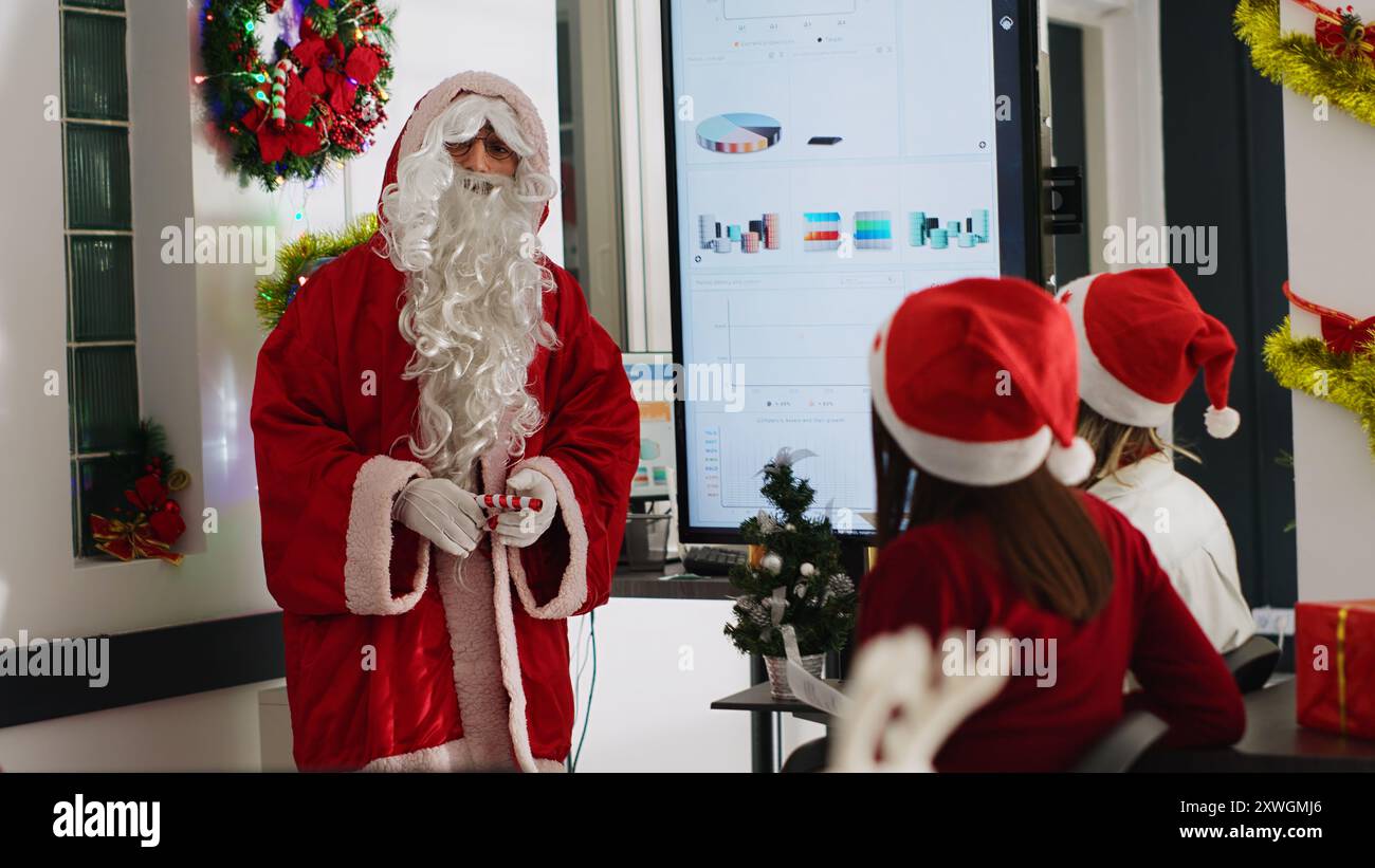 Coworker dressed santa claus hi-res stock photography and images - Alamy