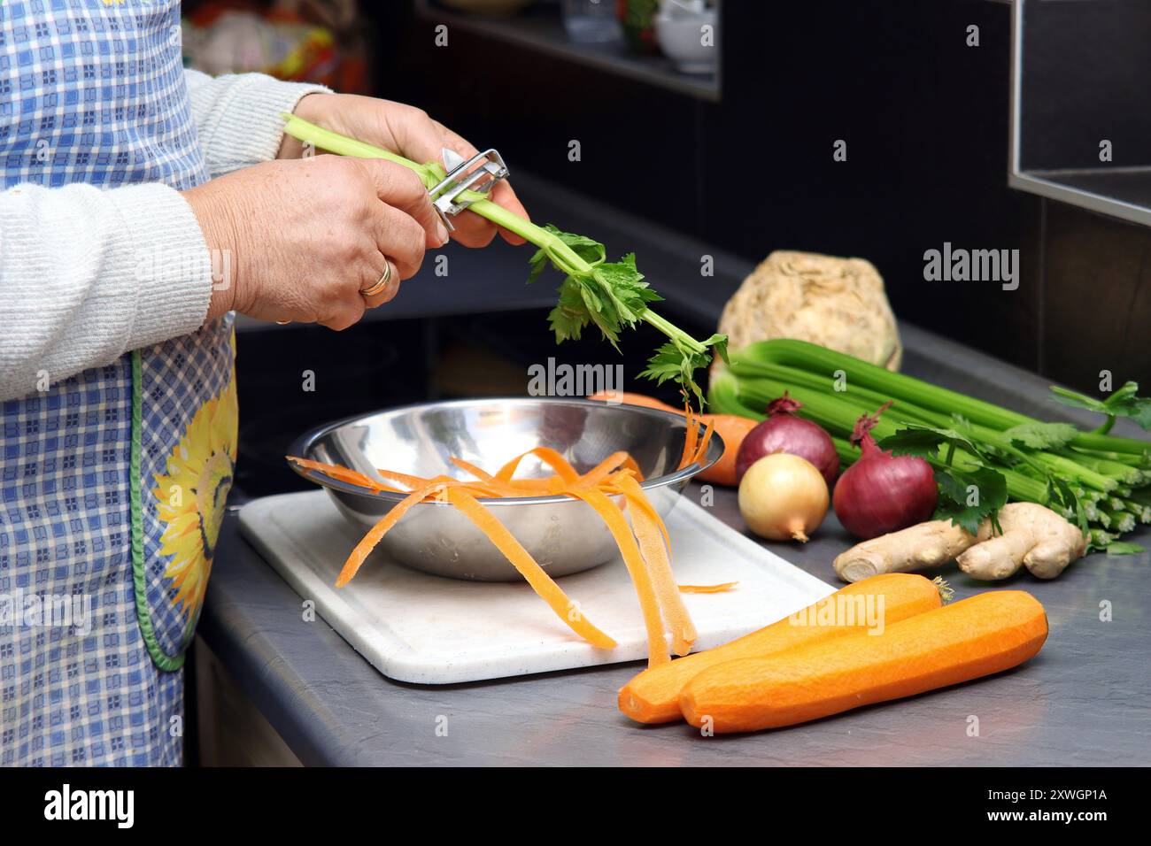 woman peeling cellery Stock Photo - Alamy