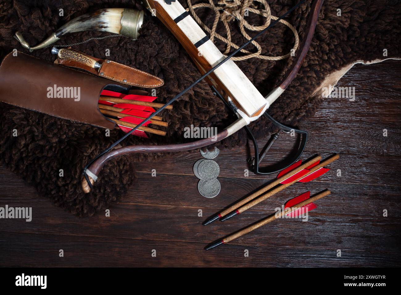 vintage medieval crossbow with accessories on wooden deck background ...