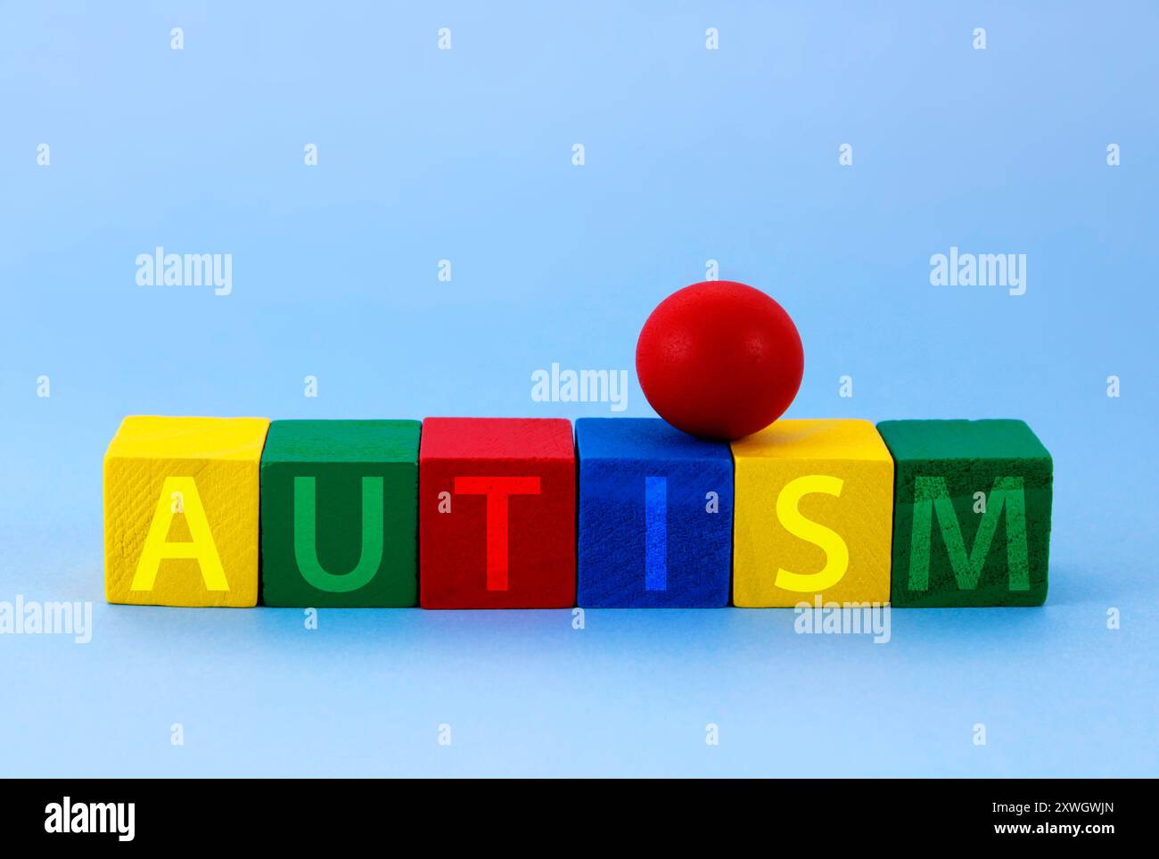 Autism, sphere on group of colorful cubes Stock Photo - Alamy