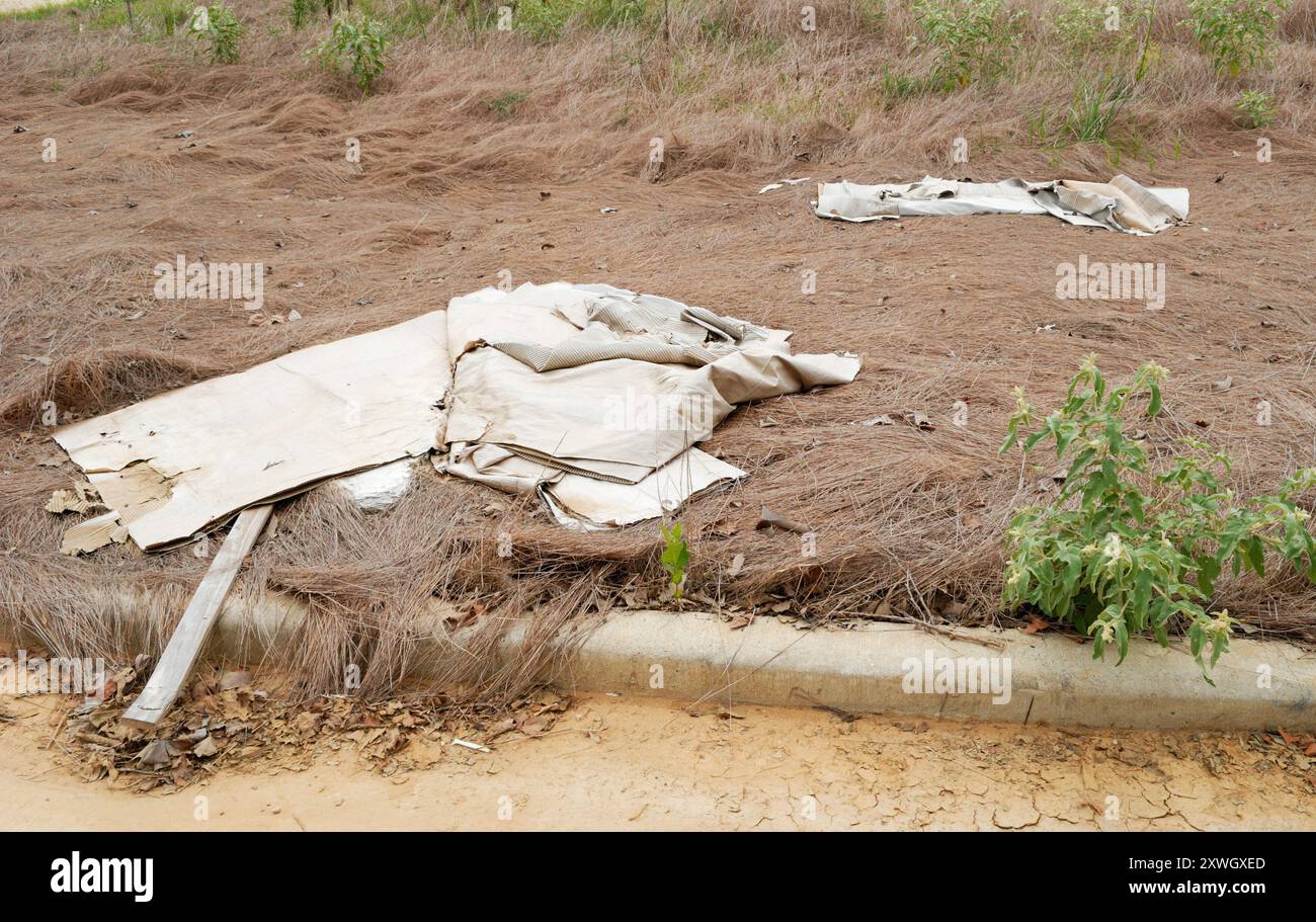 Illegal dumping on side of road Stock Photo - Alamy