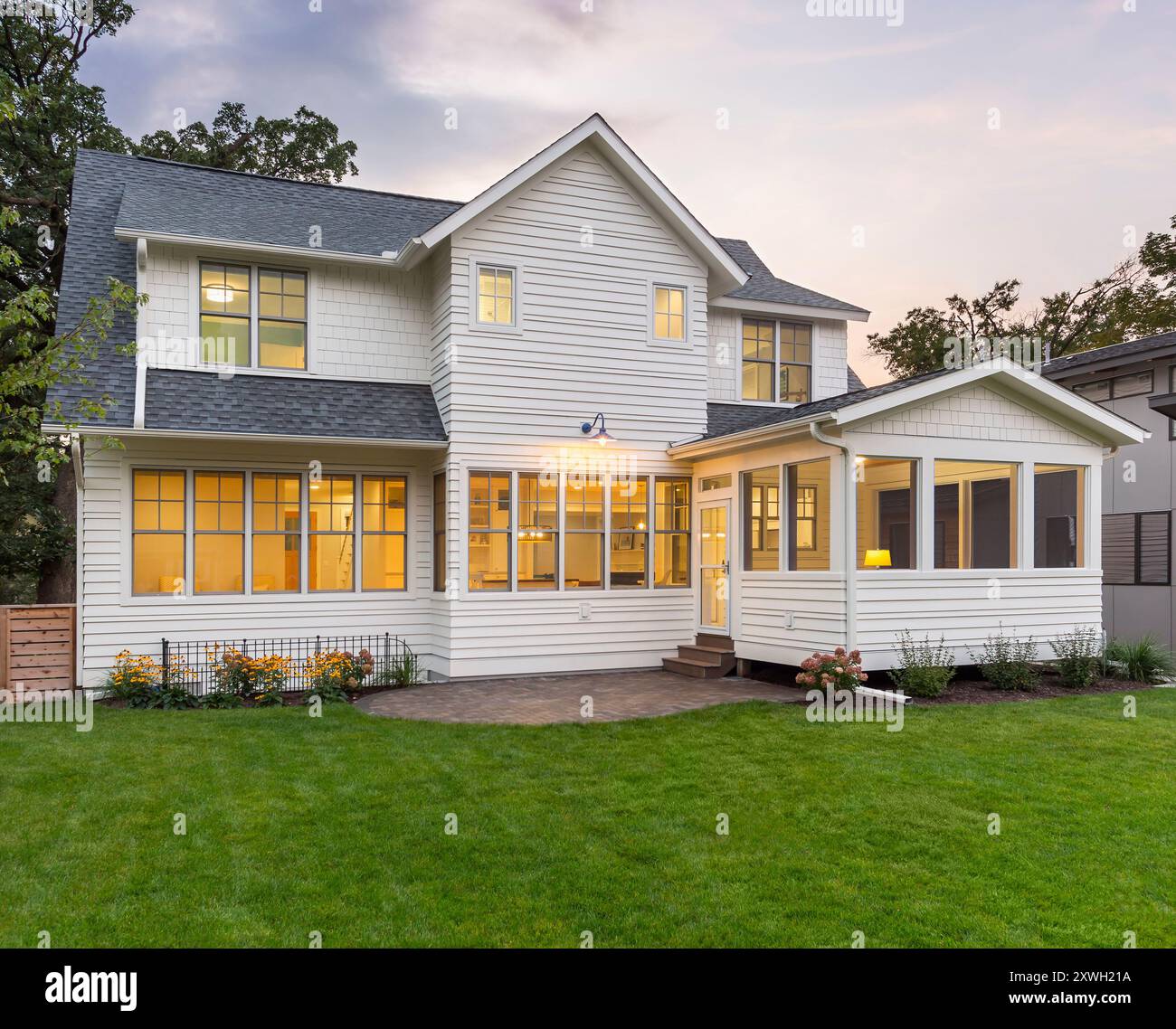 Back exterior of new white clapboard house with screened porch Stock ...