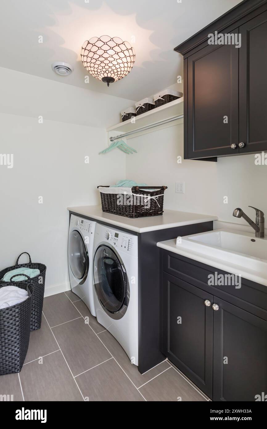 New laundry room with counter on top of washer and dryer and dark ...