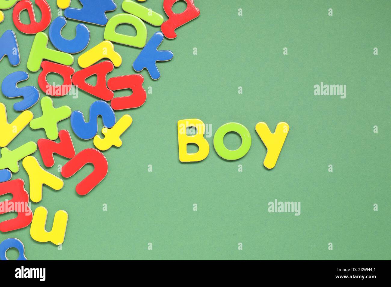 Word Boy made of magnetic letters on green background, flat lay ...