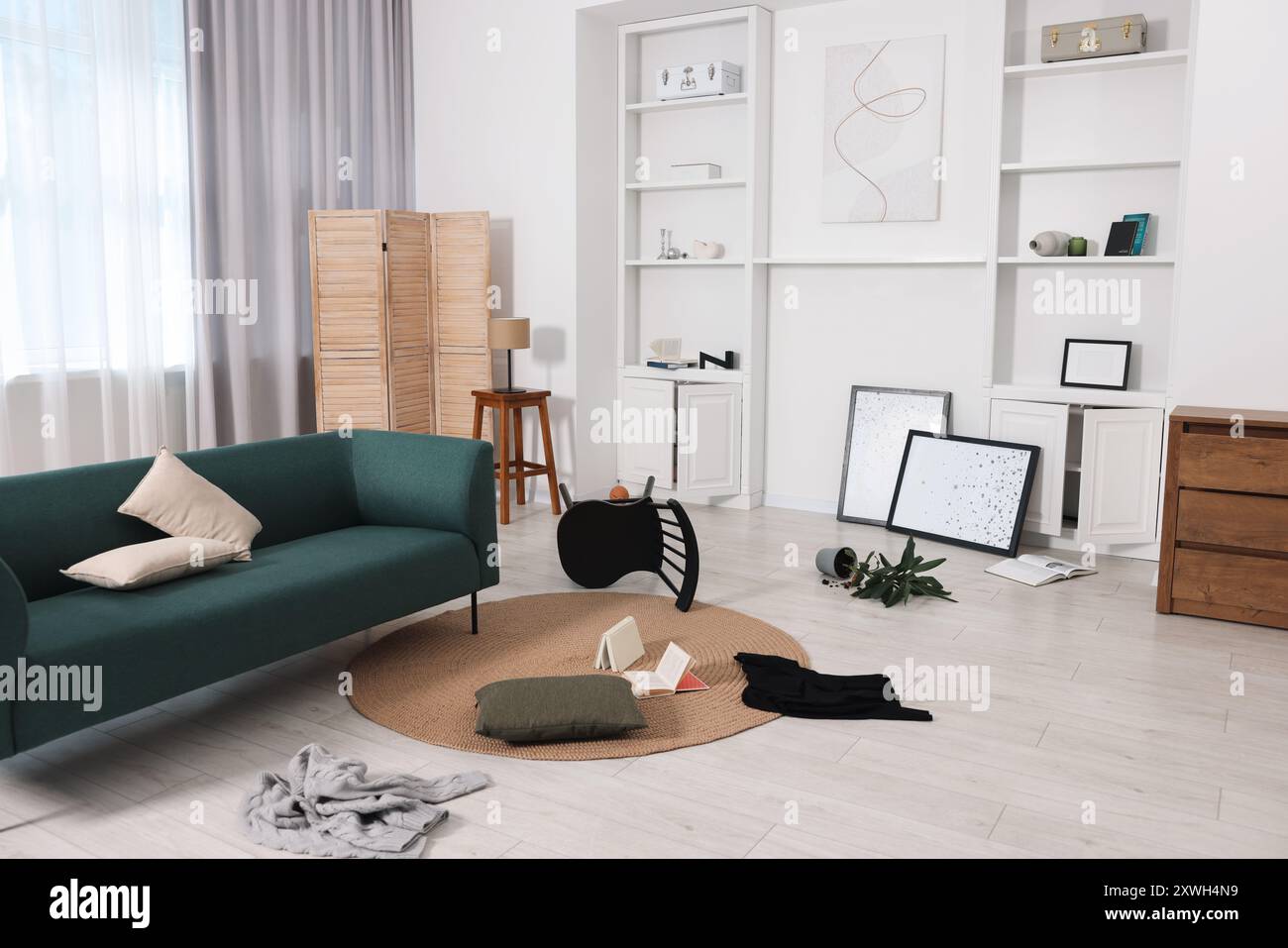 View on messy living room interior after robbery Stock Photo - Alamy