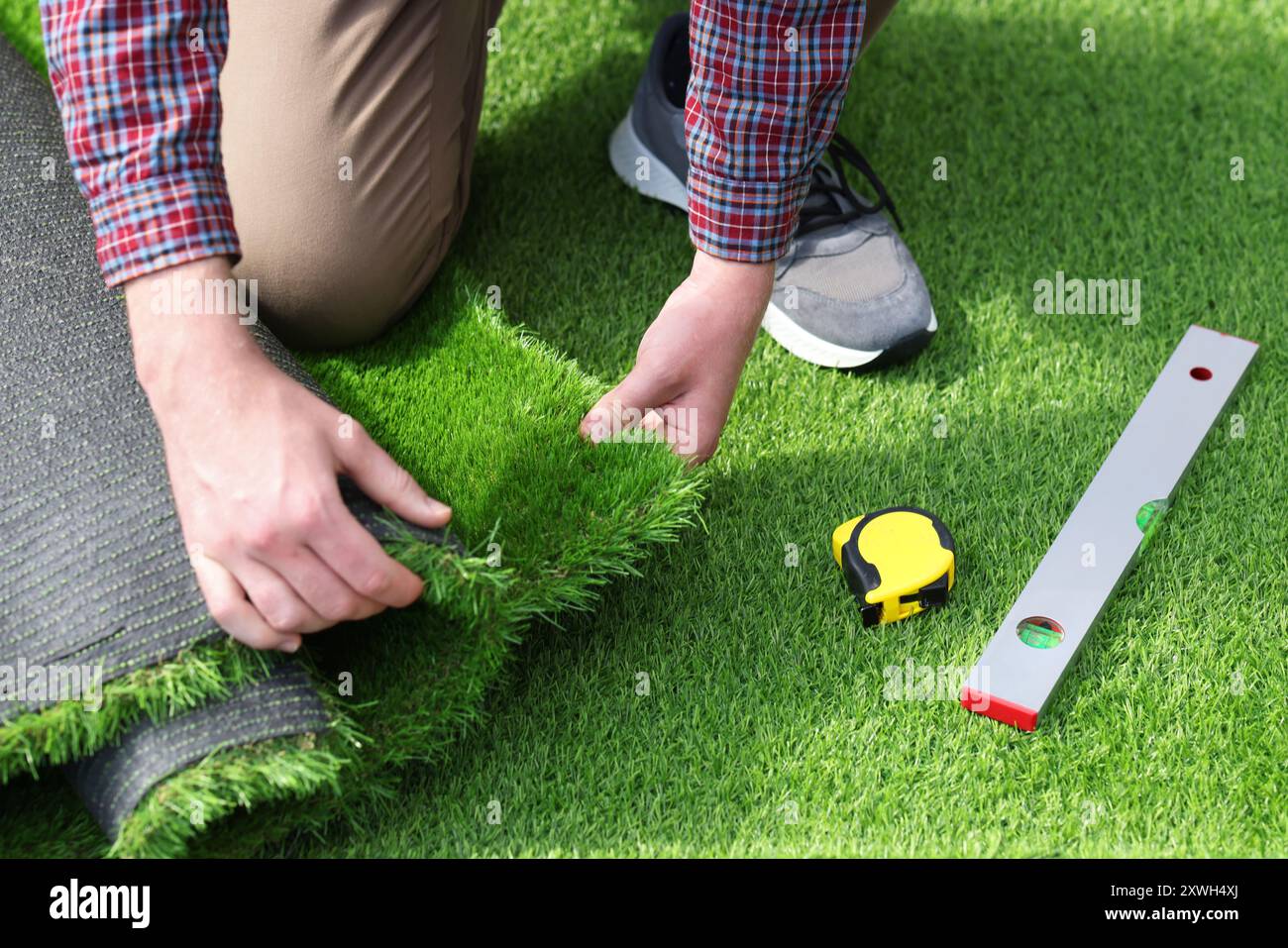 Artificial grass turf installation hi-res stock photography and images ...