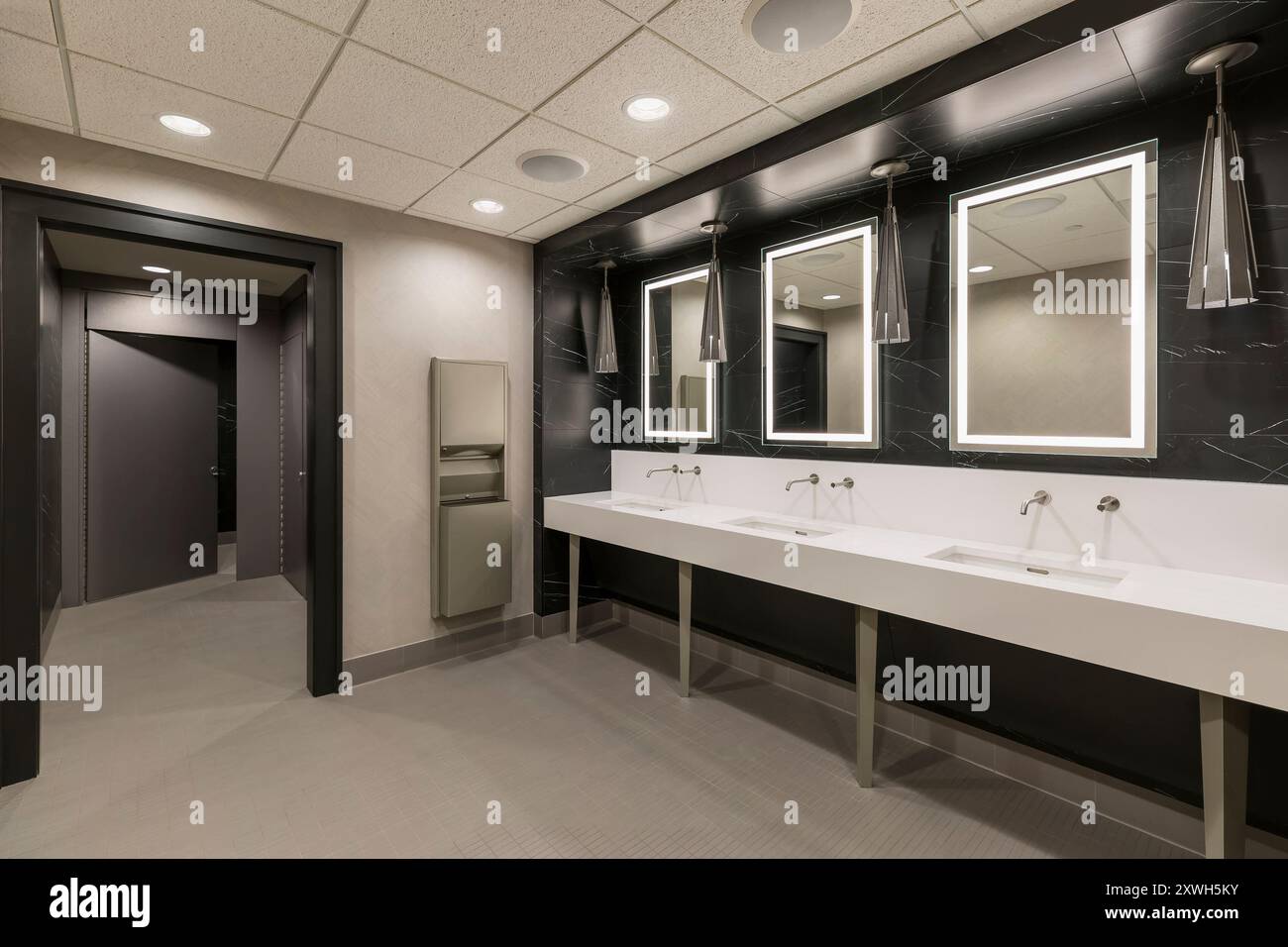 Men’s bathroom at private golf club with black and white color scheme ...