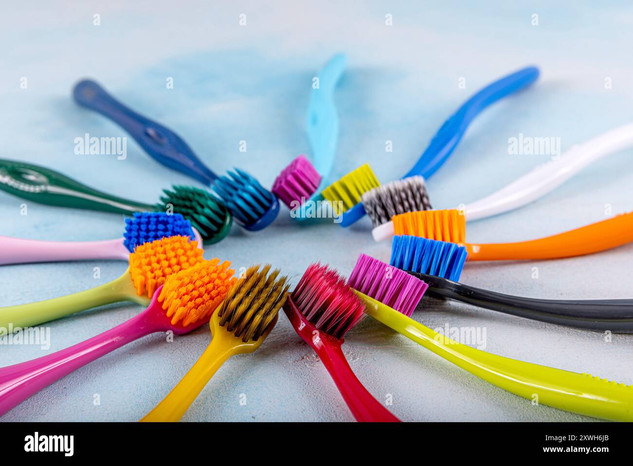 A close up of many different types of toothbrushes.Colored toothbrushes ...