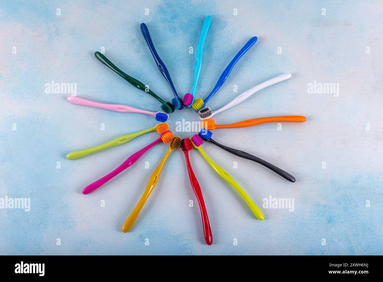 A close up of many different types of toothbrushes.Colored toothbrushes ...