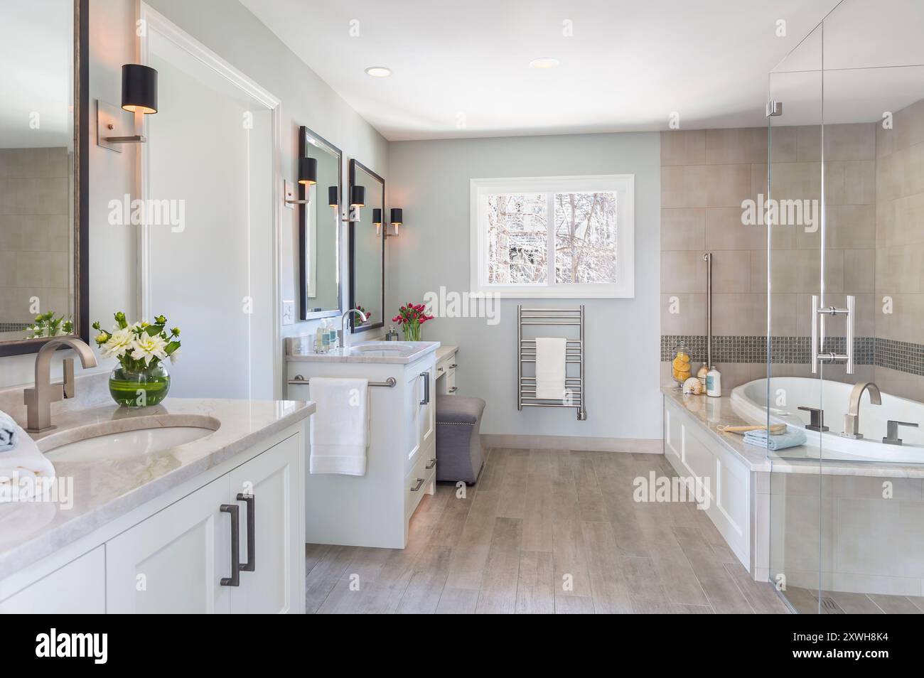 Upscale bathroom with two vanities, large walk-in shower and bathtub ...