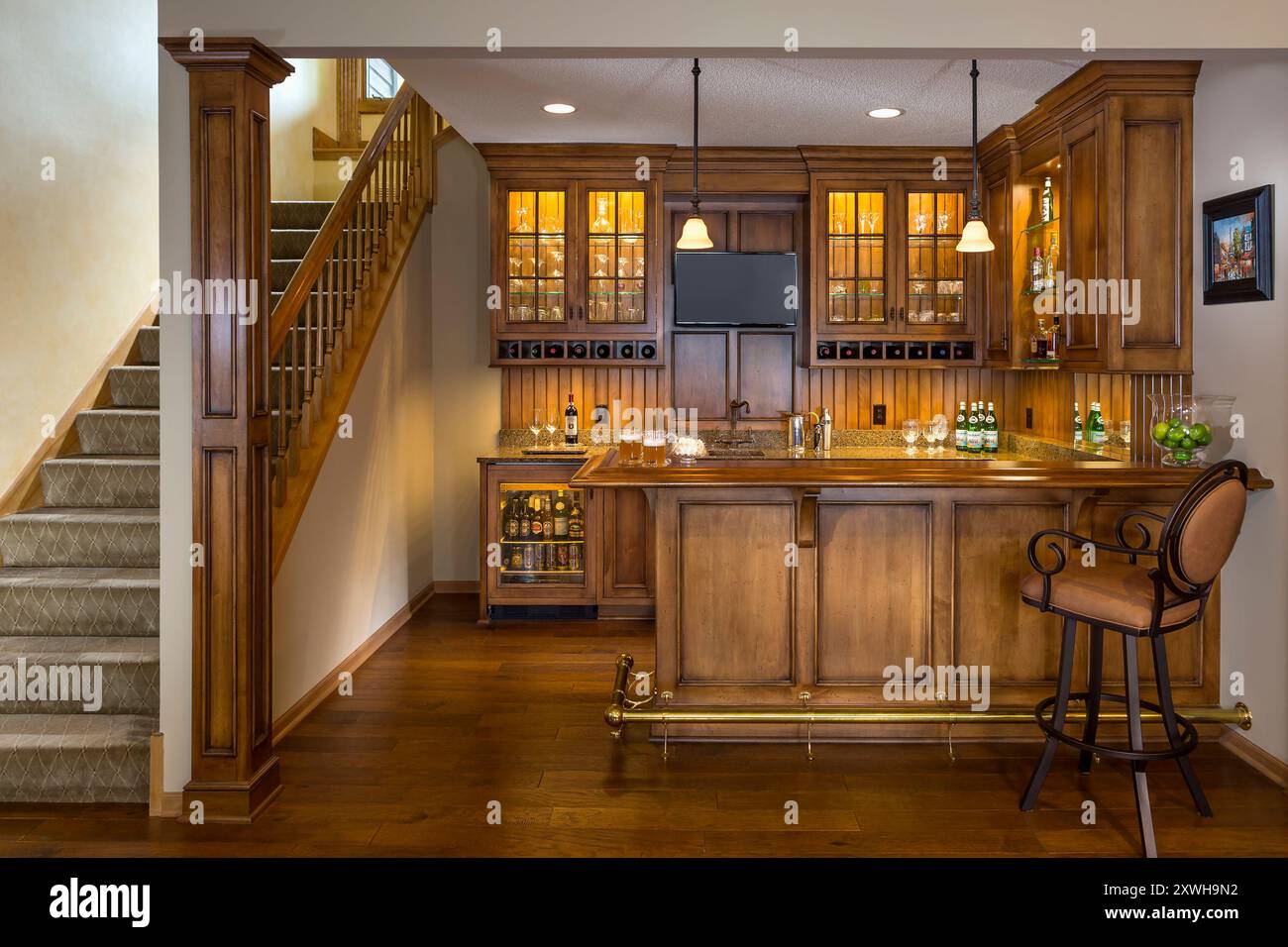 English pub style bar area in lower level of home Stock Photo - Alamy