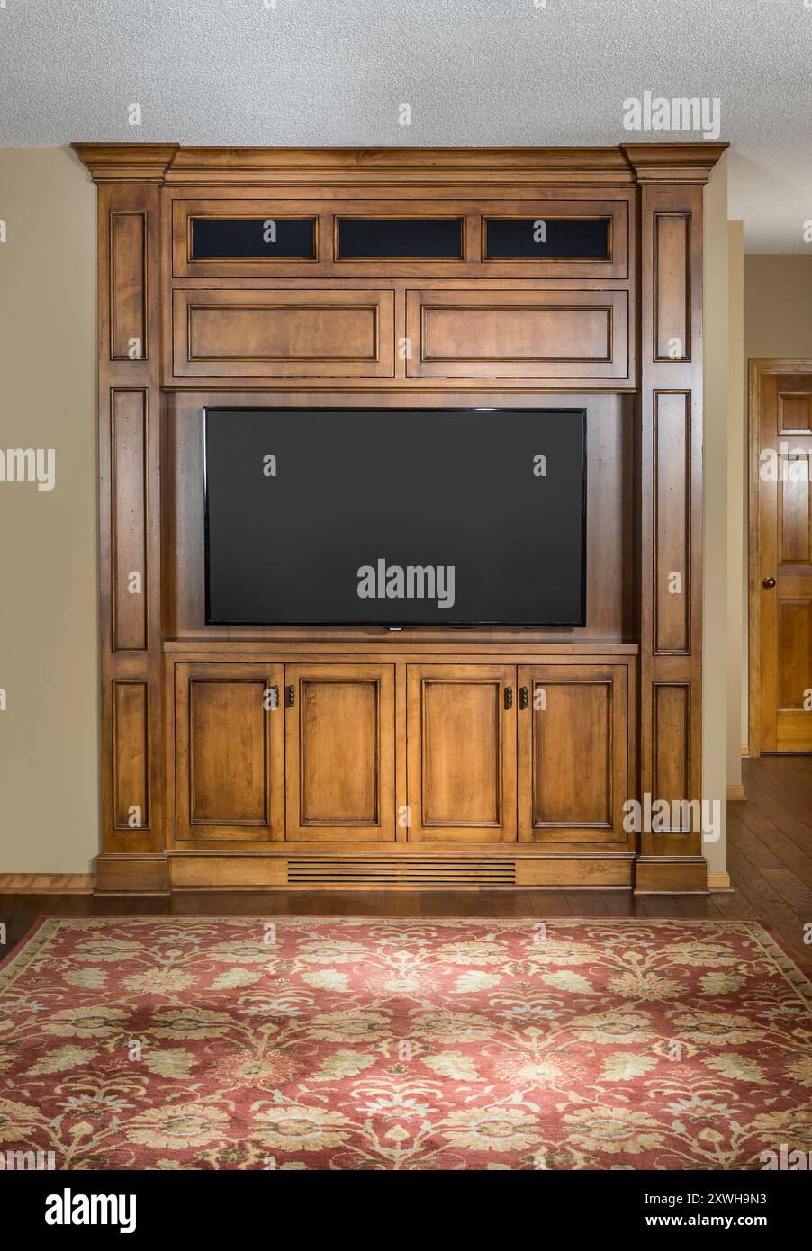 Built-in cabinet for large flat screen television Stock Photo - Alamy